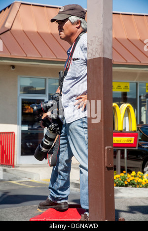 Carrying two digital cameras, Associated Press photographer Nick Ut ...