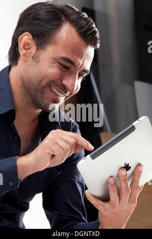 Man using iPad Stock Photo - Alamy