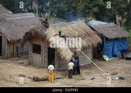 Angami tribal people making hut of hay, Kohima, Nagaland, India Stock ...