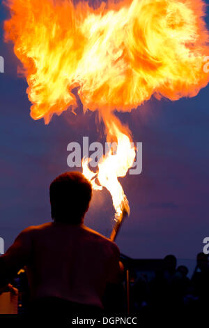 A fire eater performing Stock Photo - Alamy