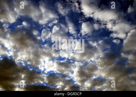 Storm clouds contrasting with blue sky during rapidly changing weather ...