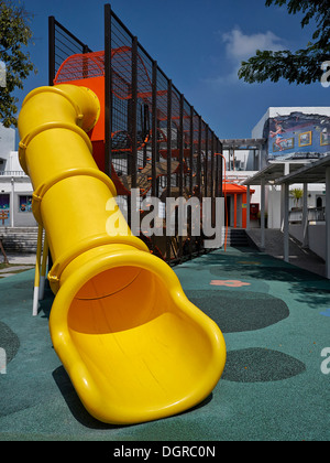 Tunnel slide in bright yellow paint Stock Photo - Alamy
