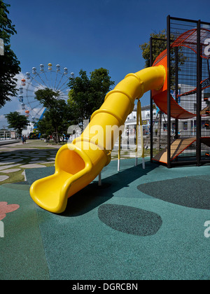 Tunnel slide in bright yellow paint Stock Photo - Alamy