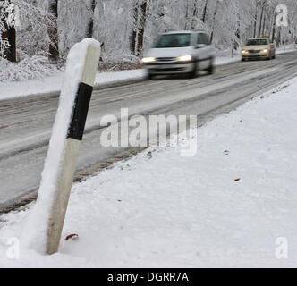 Snow covered traffic light and trees near town of Banff, Canadian ...