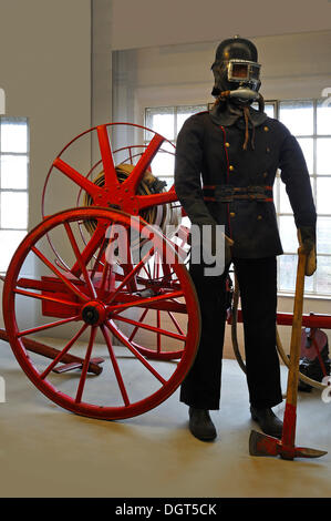 Exhibition firefighter dummy in fire fighter helmet and uniform ...