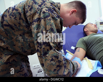 Hospitalman Third Class Michael Boeji, a corpsman with Black Sea ...