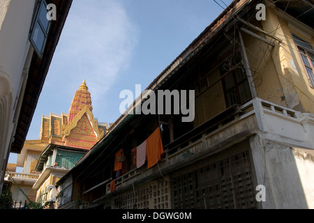 Buddhist monk's living quarters stand in the shadows of a Buddhist ...