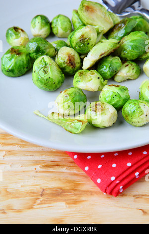 Plate with roasted brussel sprouts on table Stock Photo - Alamy