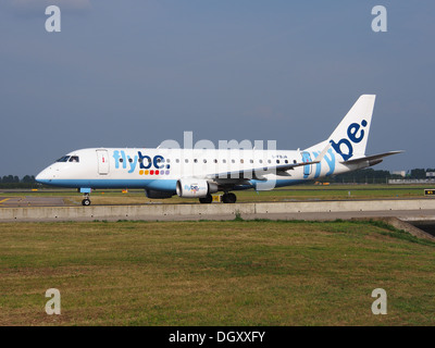 The G-FBJA Flybe Embraer ERJ-175STD, a regional jet, taxis at Schiphol ...