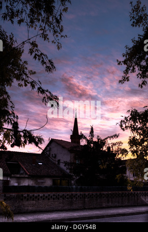 a sunset view in TOULOUSE , in a countryside . A lot of clouds have ...