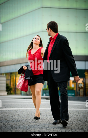 Hurry - young business man draging her girlfriend on street Stock Photo ...