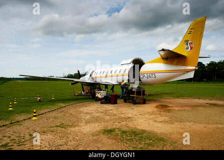 Aircraft plane grass runway airstrip hanger buildings rural countryside ...
