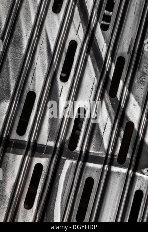 Metal door with diagonal black, white and red lines and square nails ...