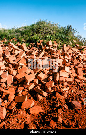 Pile of red bricks in the nature Stock Photo - Alamy