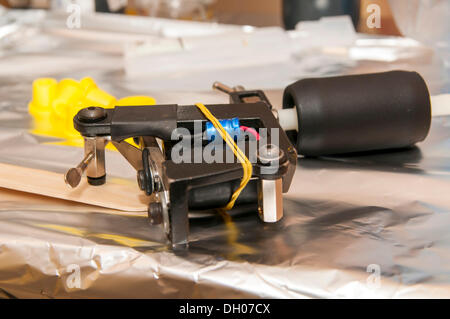 Workplace with a Micky Sharpz Model Paul Rogers tattoo machine and ink ...