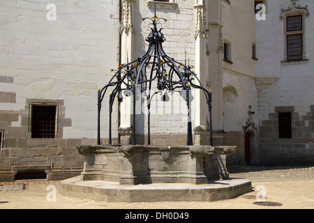 The wrought iron well canopy in the courtyard of the Chateau des Ducs ...