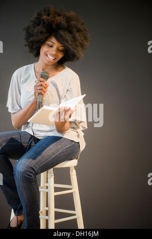 Young woman reading book of poetry, London: MODEL RELEASED Stock Photo ...