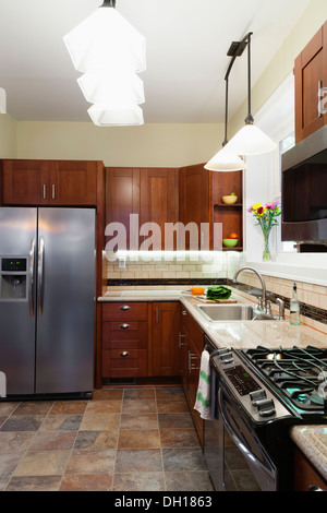 Appliances and cabinets in kitchen Stock Photo - Alamy
