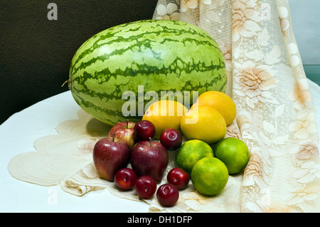 Fruits watermelon mangoes apples plums oranges Stock Photo - Alamy
