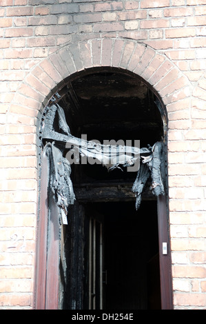 Severe house fire front door UPVC Burnt Melted Stock Photo - Alamy