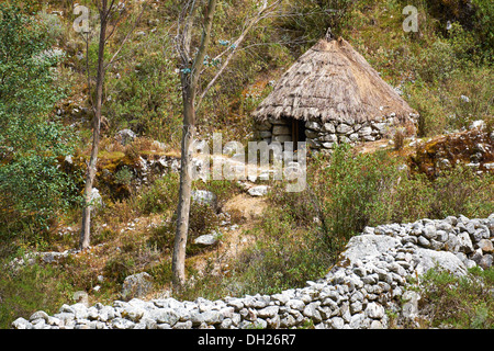 A traditional stone hut at Cojup in the Peruvian Andes, South America ...