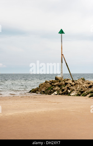 Beach at Old Colwyn-Colwyn Bay, North Wales. Rock in the water Stock ...