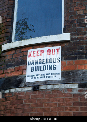 Dangerous building keep out sign on building ready to be demolished ...