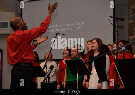 a choir director directing a choir Stock Photo - Alamy