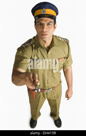 Angry looking police officer pointing his finger at you Isolated on ...