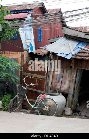 A dilapidated shack inhabited by garment workers is part of the urban ...