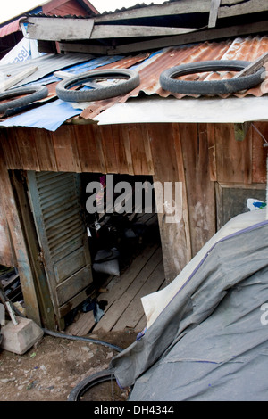 A dilapidated shack inhabited by garment workers is part of the urban ...