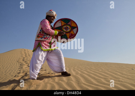 man playing musical instrument duff and woman dancing Rajasthan India ...