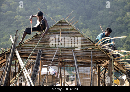 men making bamboo huts at Papi Hill at Rajahmundry Andhra Pradesh India ...