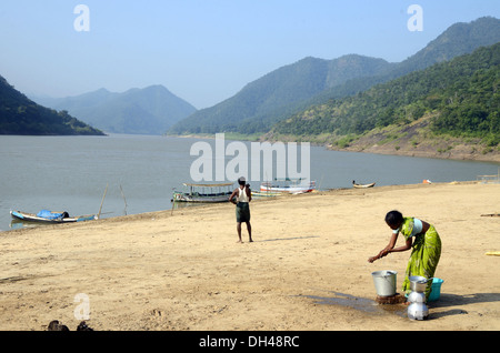 Indian women washing hands by the river, Rajasthan, India Stock Photo ...