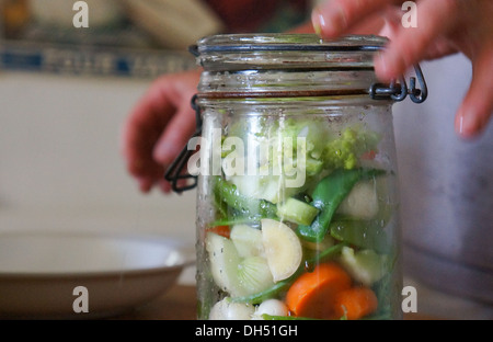 Fermenting vegetables in glass jar,prepare Stock Photo - Alamy