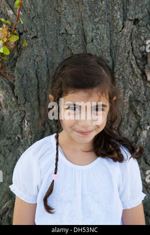 girl, tree trunk, ajar, girls, trunks, ajars Stock Photo - Alamy