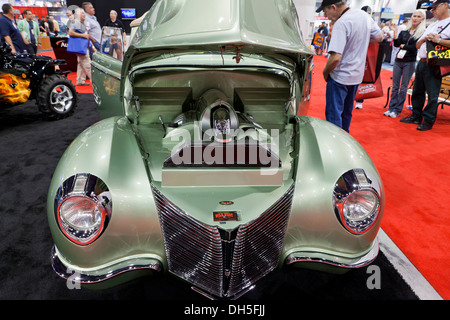 Restored classic car displaying engine bay area with hood open at a car ...
