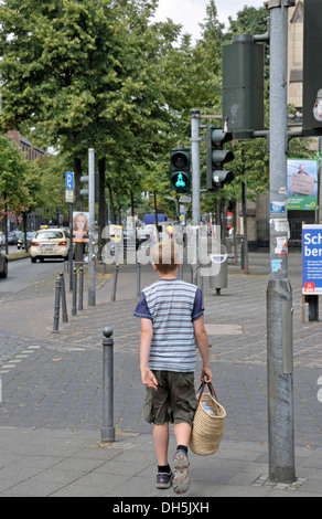 rear view of a nine year old boy wihout a top wearing a straw Stock ...