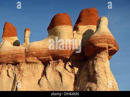 Eroded hoodoos and rock formations discolored by minerals in Ha Ho No ...