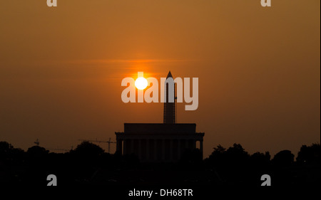 The sun rises over the Washington Monument Wednesday, July 1, 2026, in ...