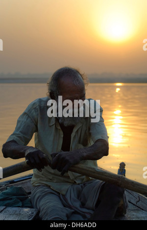 Elderly man rowing, Ganges River, Varanasi, India Stock Photo - Alamy