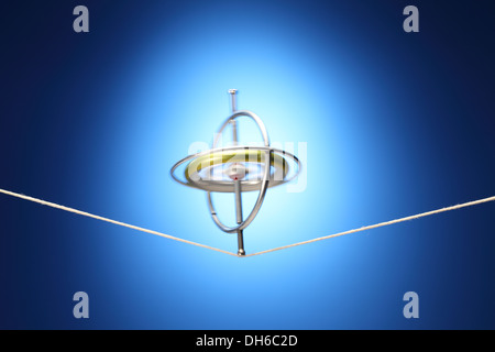 Toy gyroscope spinning. A gyroscope is a heavy spinning disc mounted so ...