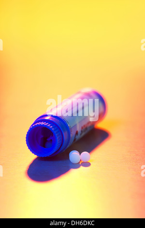 Homeopathic medication - blue container and small white balls in the ...