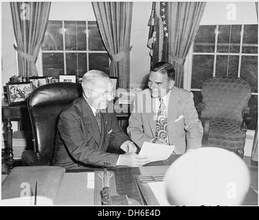 This photograph shows former President Harry S. Truman smiling during ...