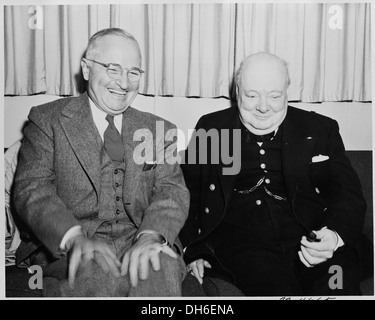 A photograph of President Harry S. Truman laughing and engaging in ...