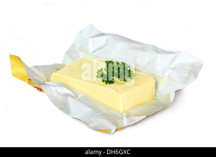 Yellow butter with paper package placed on isolated background Stock ...