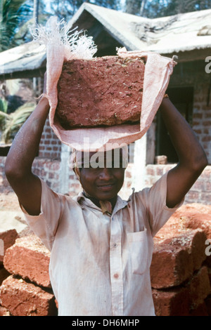 A man carry carries brick at a construction site in Pushkar city Stock ...