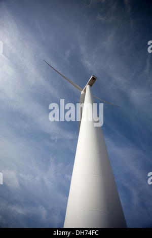 Wind energy turbine, isolated over a beautiful blue sky Stock Photo - Alamy