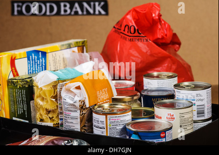 Box of essential food items ready to be handed out. Food bank charity ...