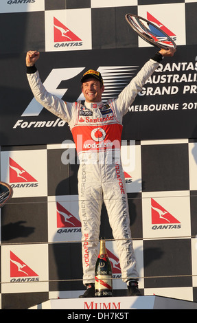 Jenson Button celebrates on the podium after winning Formula One's ...